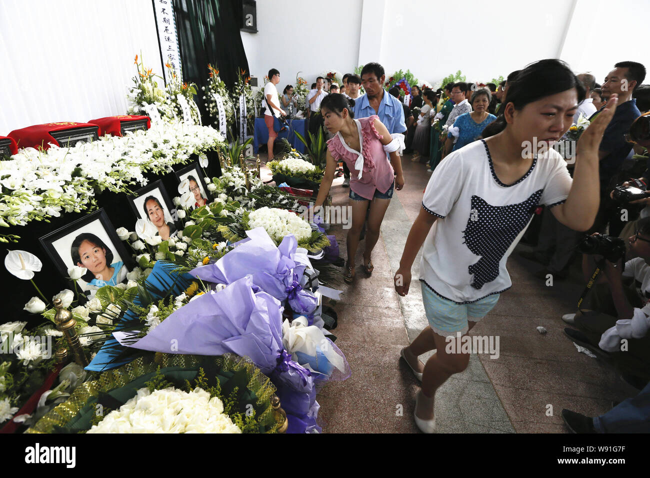 Family members of Chinese students Liu Yipeng, Wang Linjia and Ye Mengyuan, who died in the ...