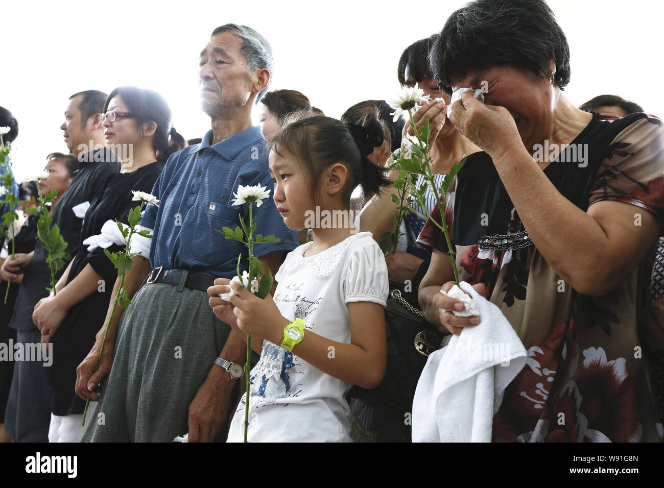 Family members of Chinese students Liu Yipeng, Wang Linjia and Ye Mengyuan, who died in the ...