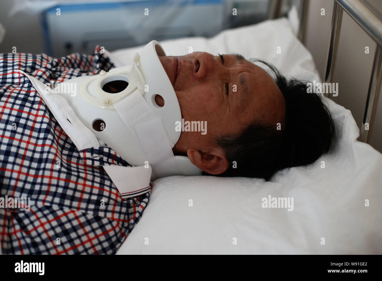 Wang Jianzhong, a 59-year-old wholesale market employee who was injured for saving a 5-year-old ...