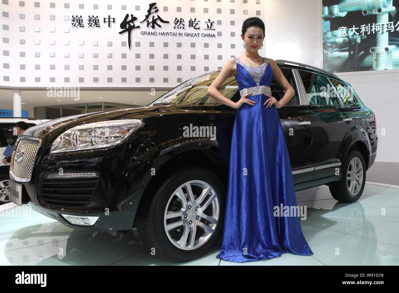 A model poses with a Boliger SUV of Hawtai Motor during the 15th ...