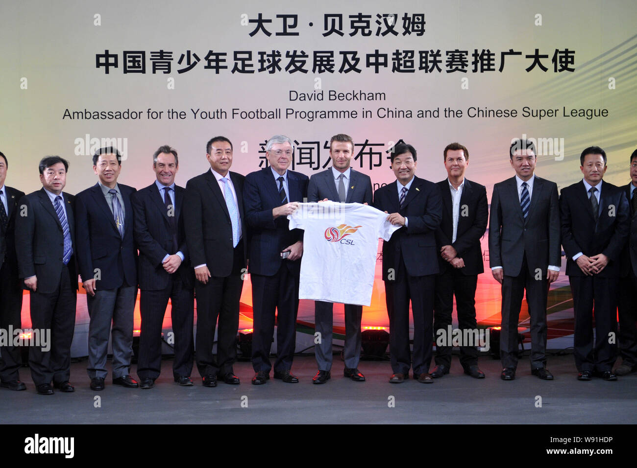 English soccer superstar David Beckham (center) poses for a group photo ...