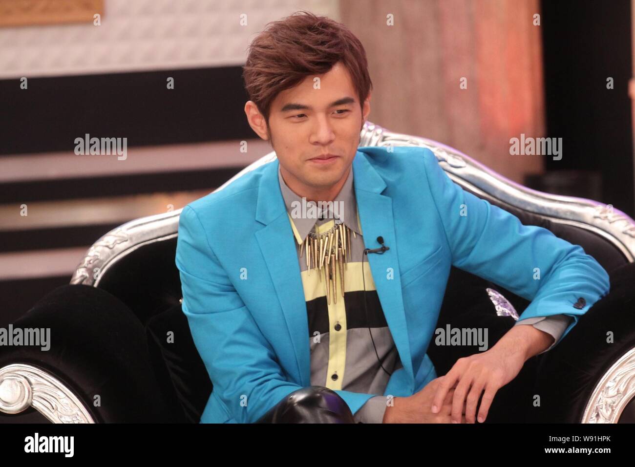 Taiwanese singer and actor Jay Chou smiles during a record of TV show ...