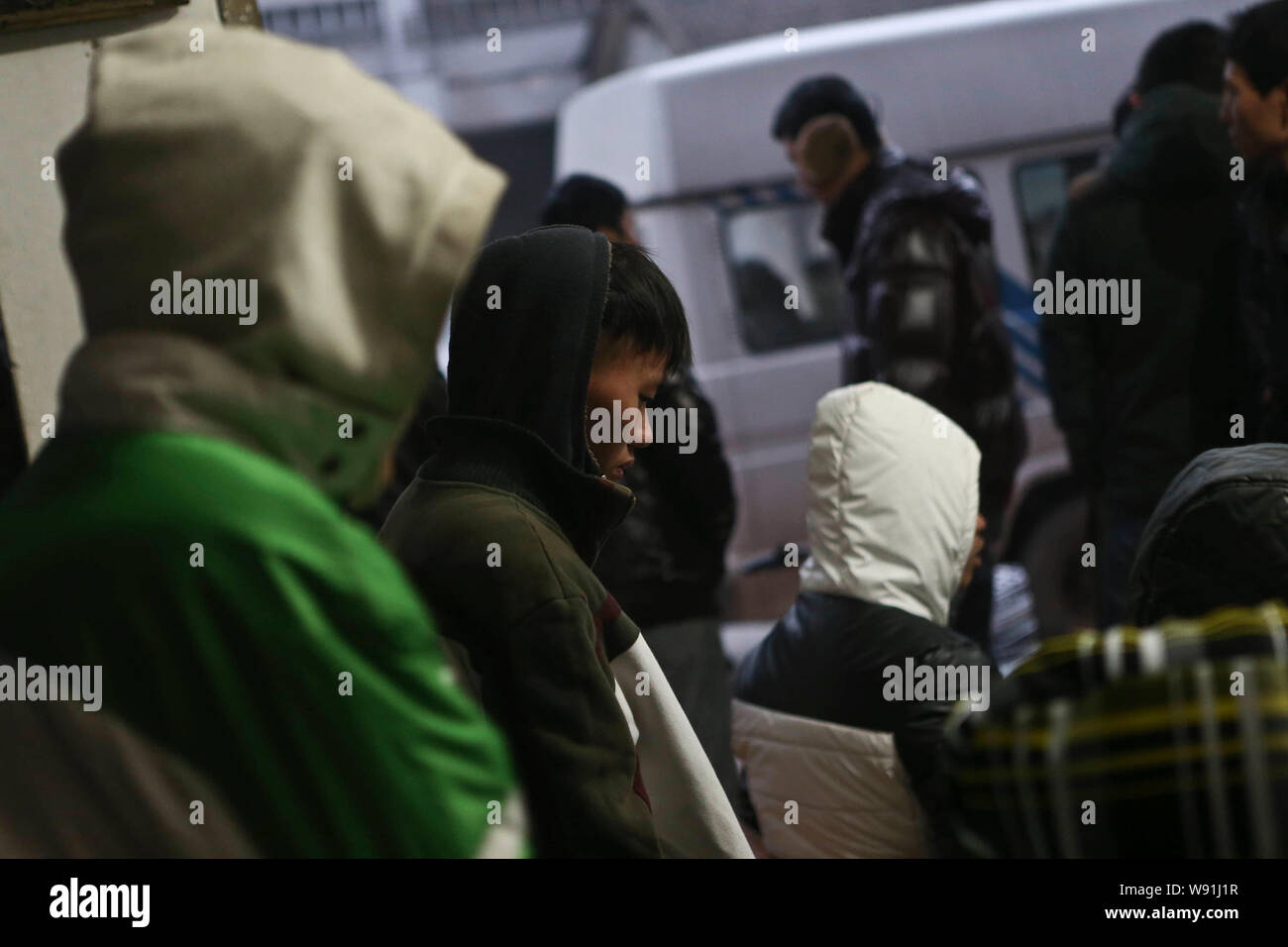 --FILE--Chinese extras wait at the filming site of a TV series at ...