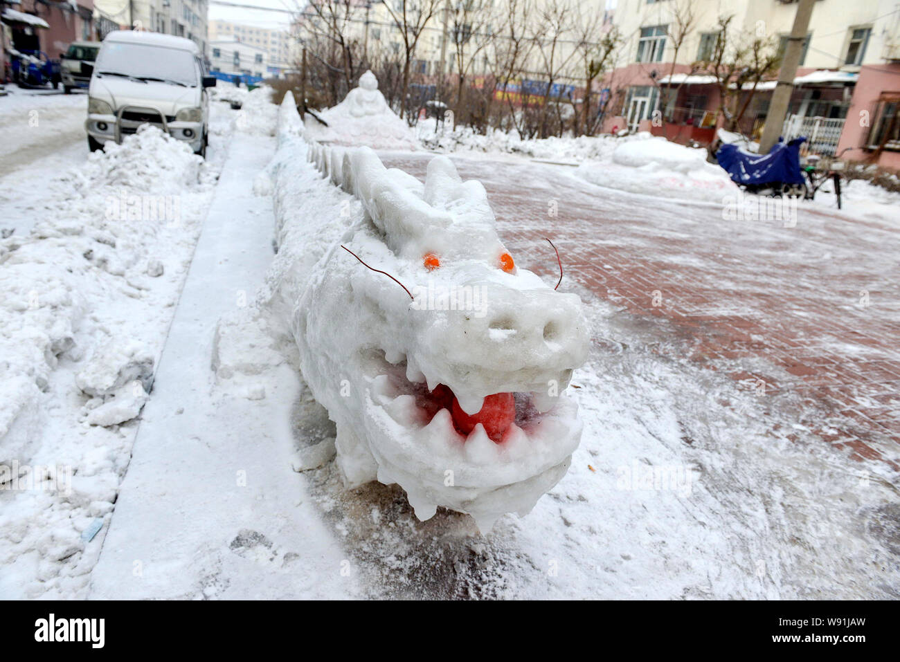 A snow dragon is pictured at a residential quarter in Jilin city ...