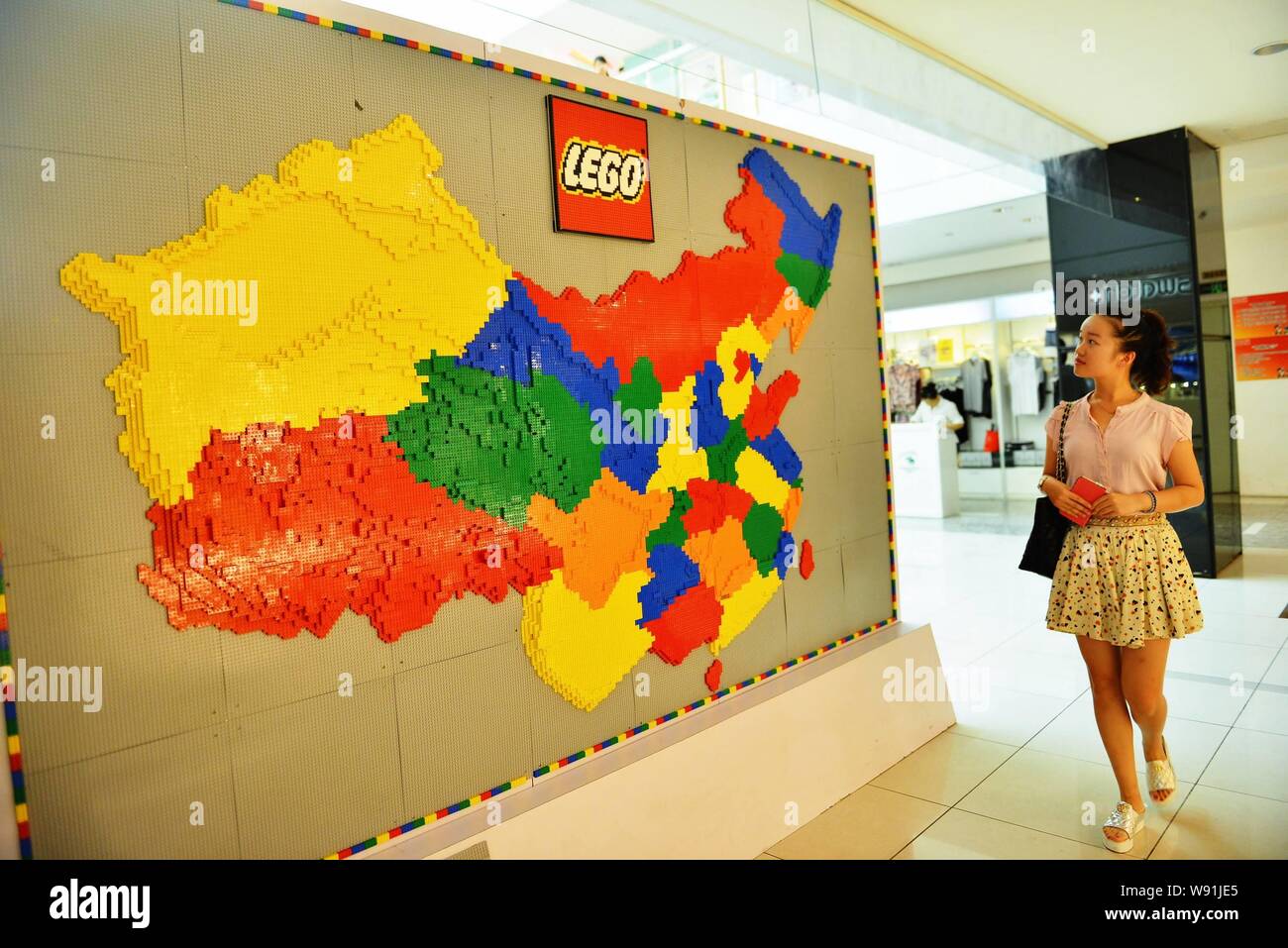 --FILE--A visitor looks at a map of China made by Lego bricks at the ...