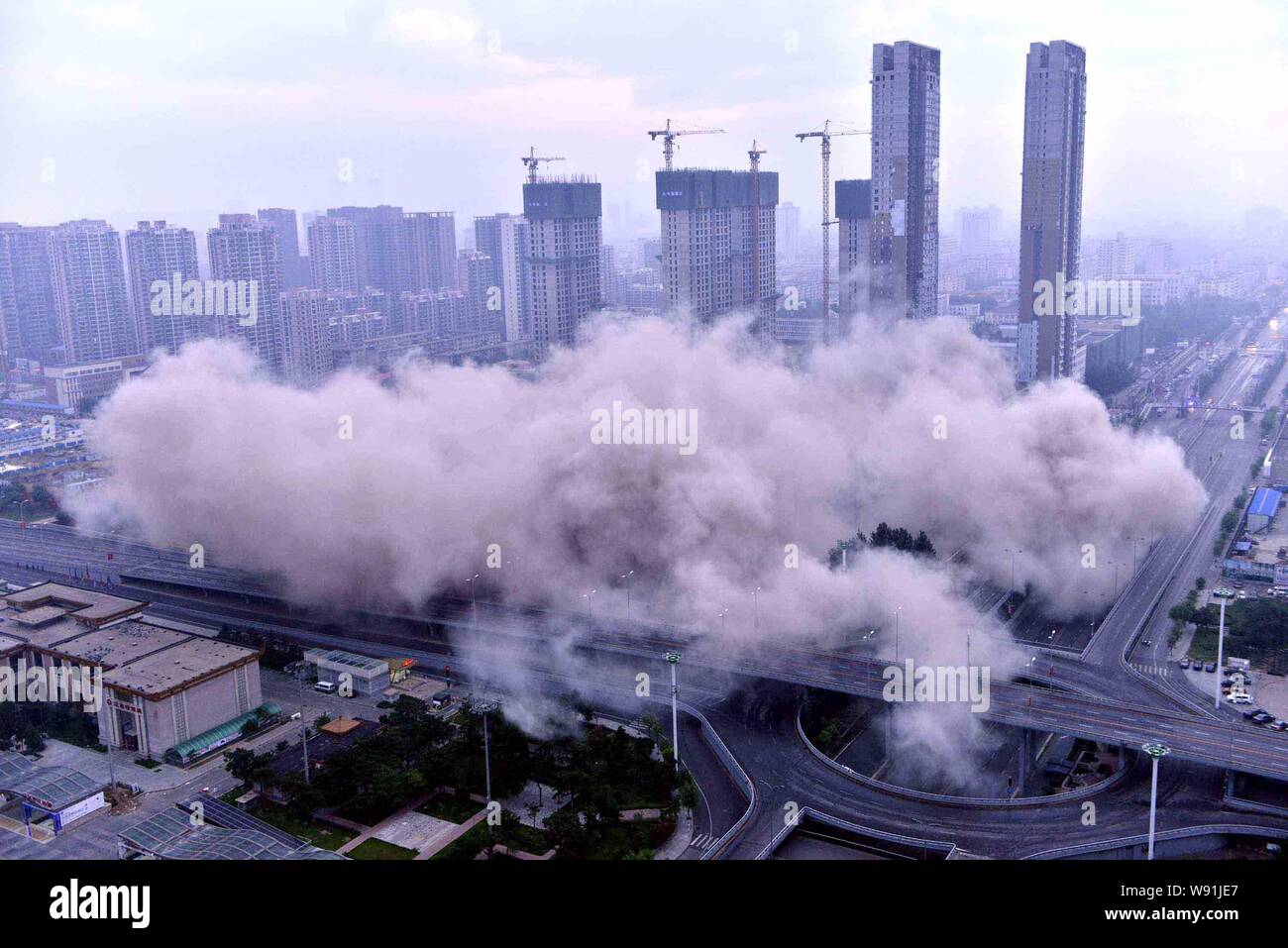 Heavy smoke rises after the thermometer-alike building exploded during ...