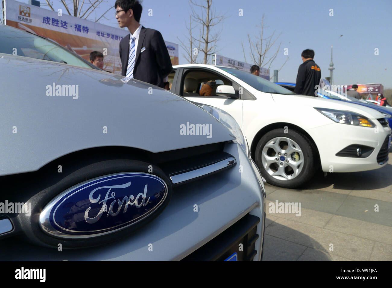 --FILE--Visitors look at Ford cars during an auto show in Qingdao city ...