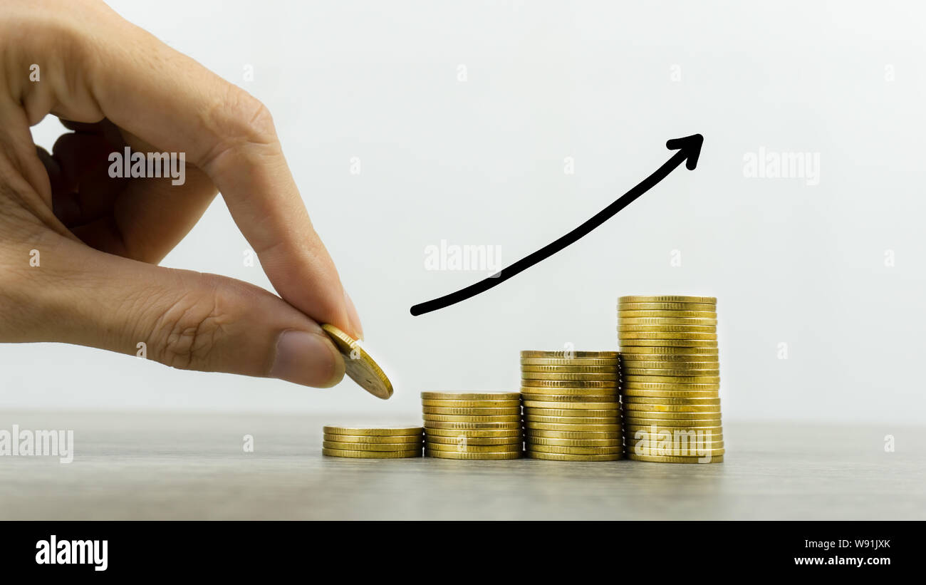 Making money and money investment concept. A businessman hand holding ...