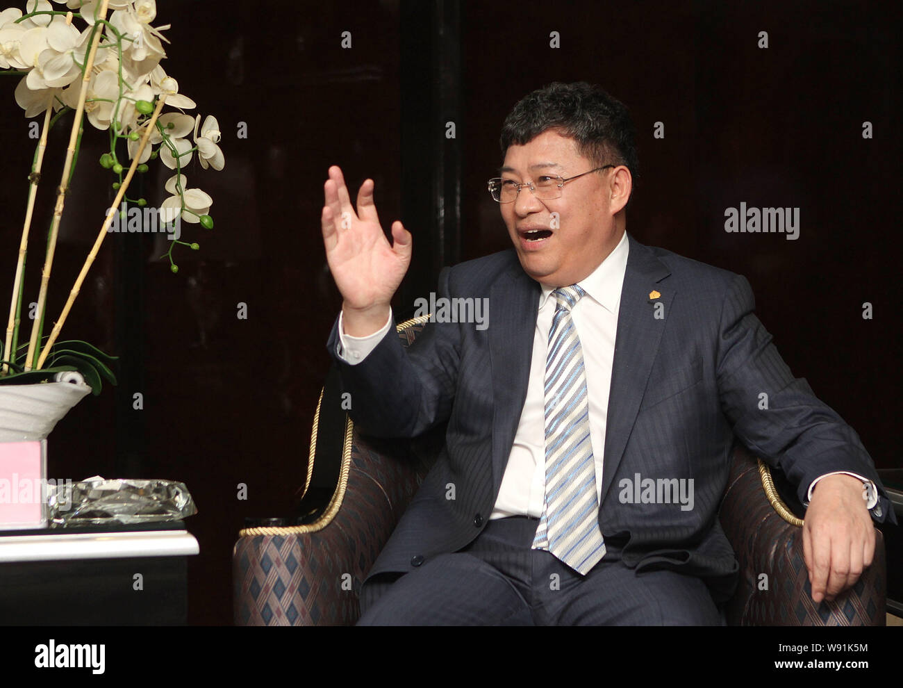 Zhang Yuliang, Chairman of Greenland Group, answers a question at an ...
