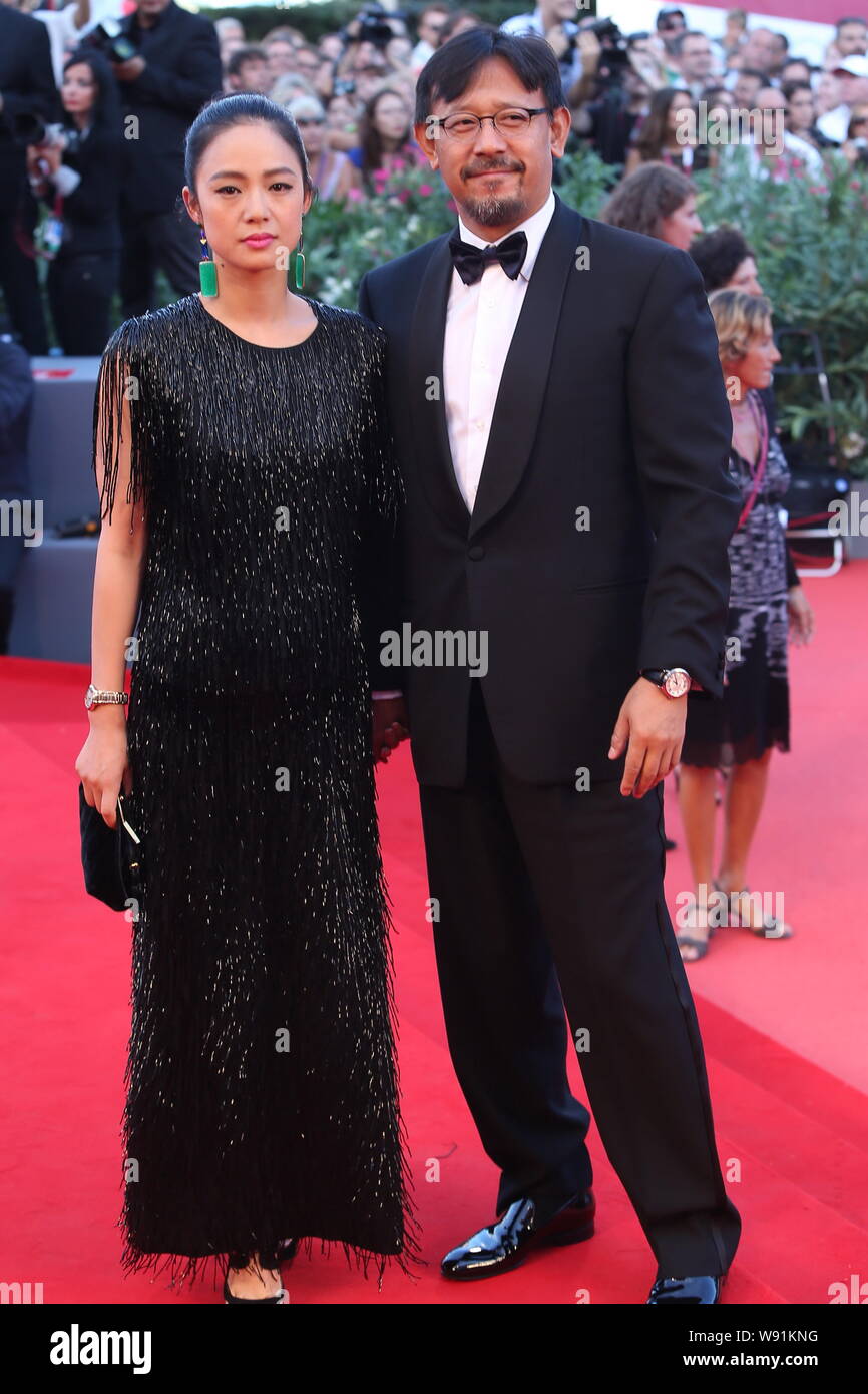 Chinese actor and director Jiang Wen, right, his wife Zhou Yun pose on ...
