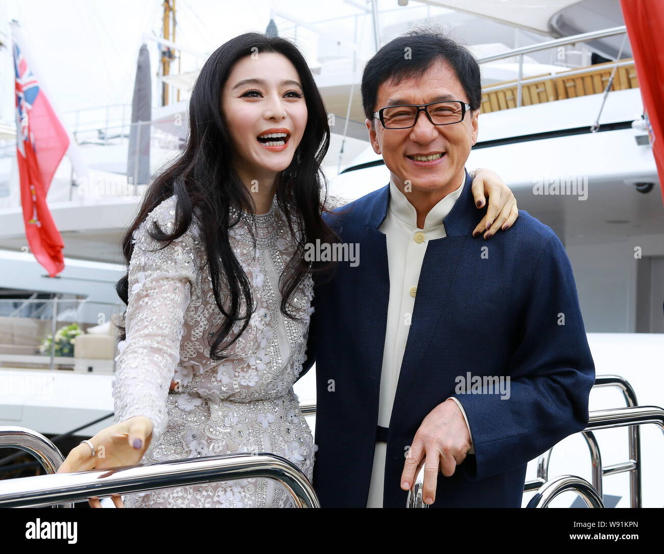 Hong Kong kungfu superstar Jackie Chan, right, poses with Chinese ...