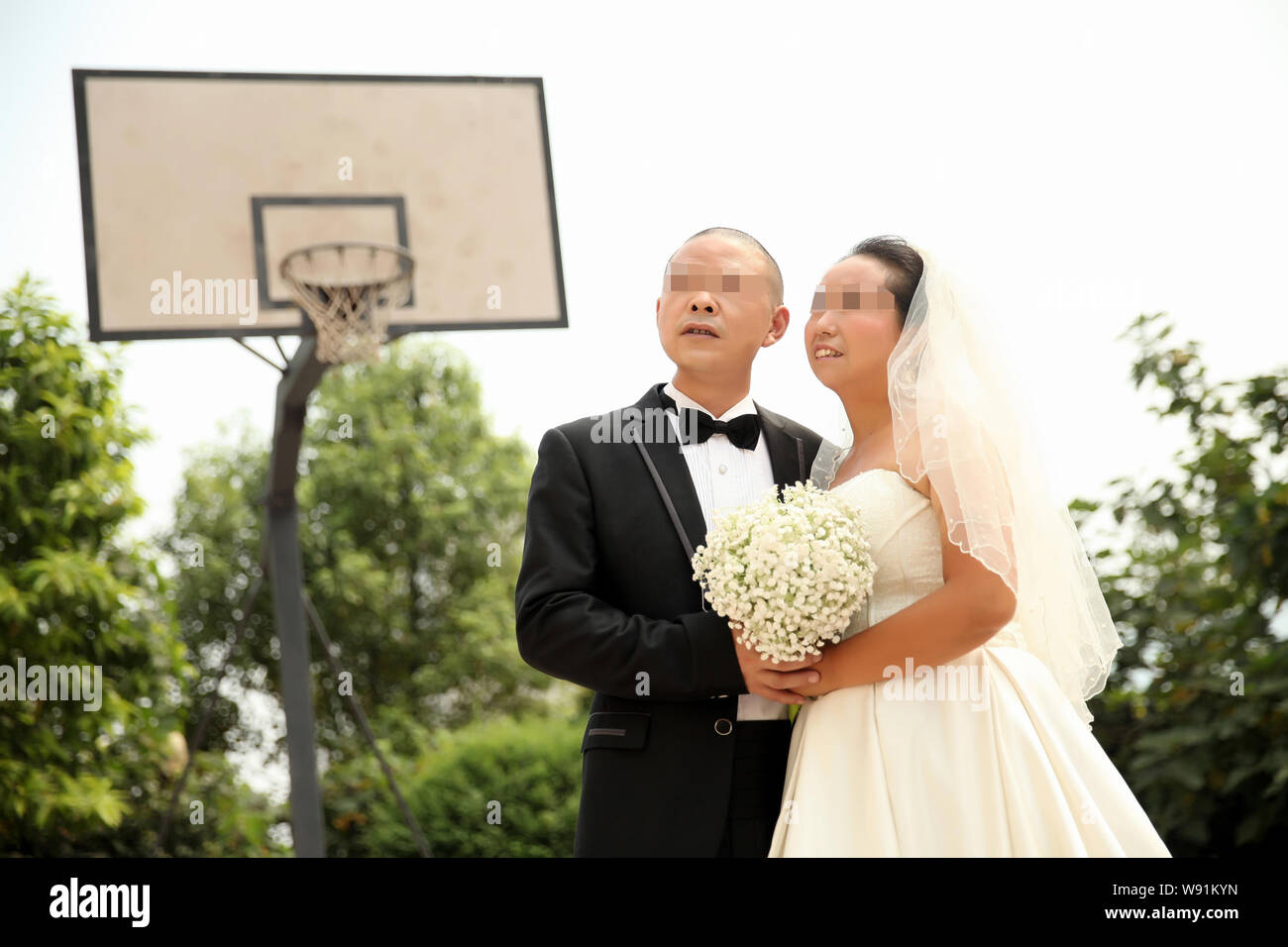 Chinese inmate Zhang Cheng, left, poses with his wife Yang Yumei during ...
