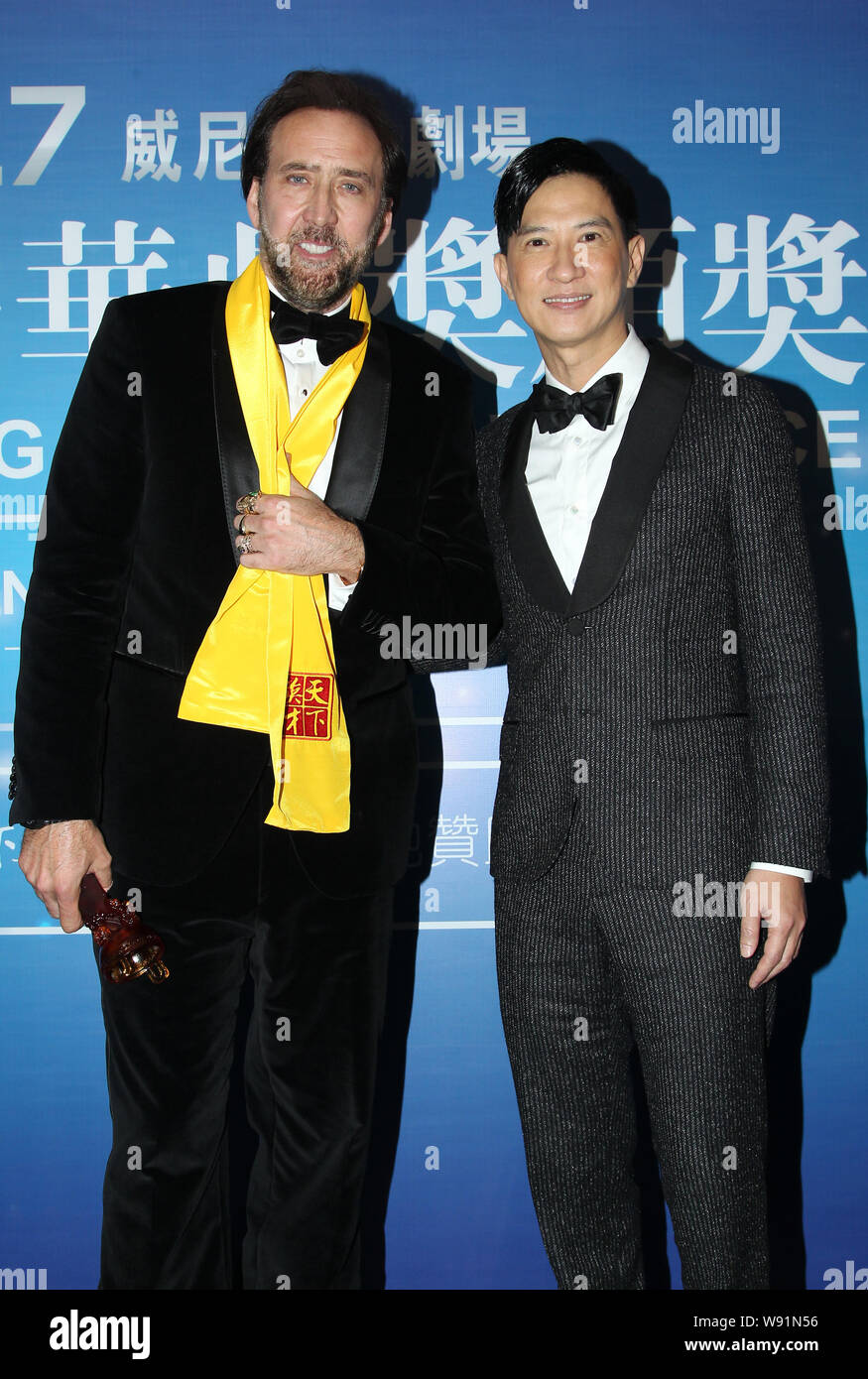 American actor Nicolas Cage, left, poses with Hong Kong actor Nick ...