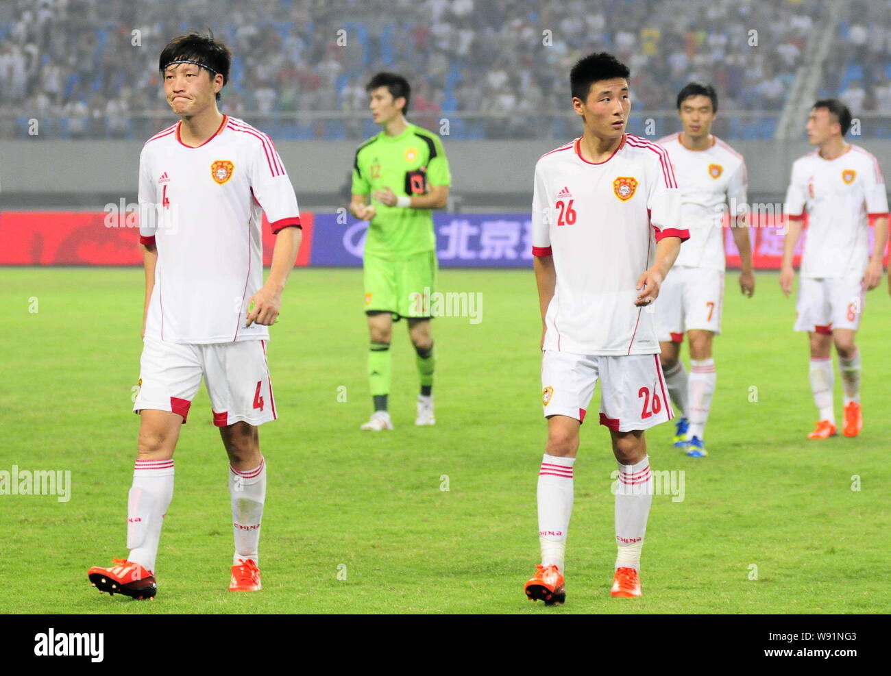 Chinese national soccer team players Zhao Peng, right, Wu Lei walk on ...