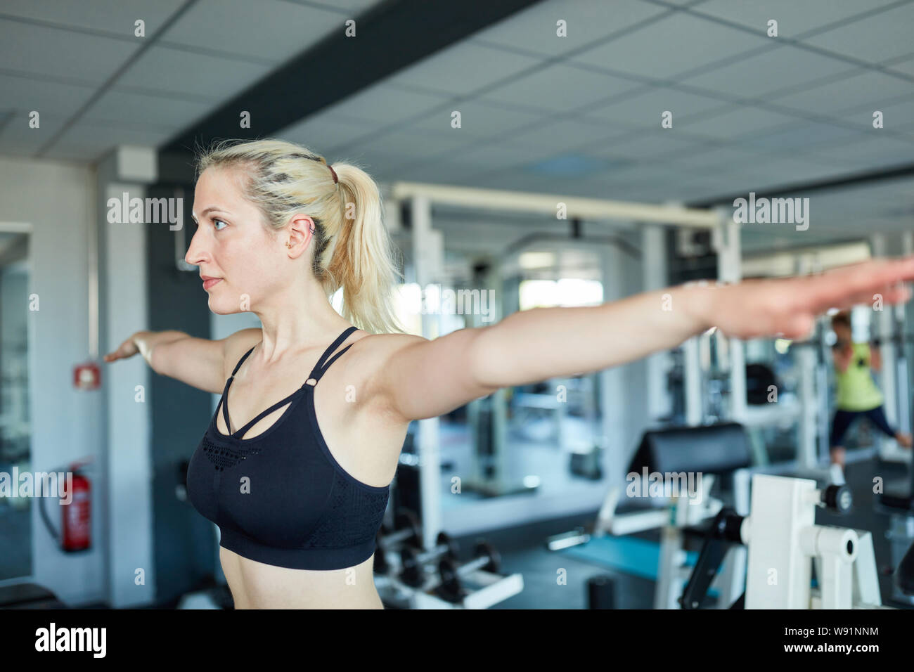 Woman stretch arms hi-res stock photography and images - Alamy