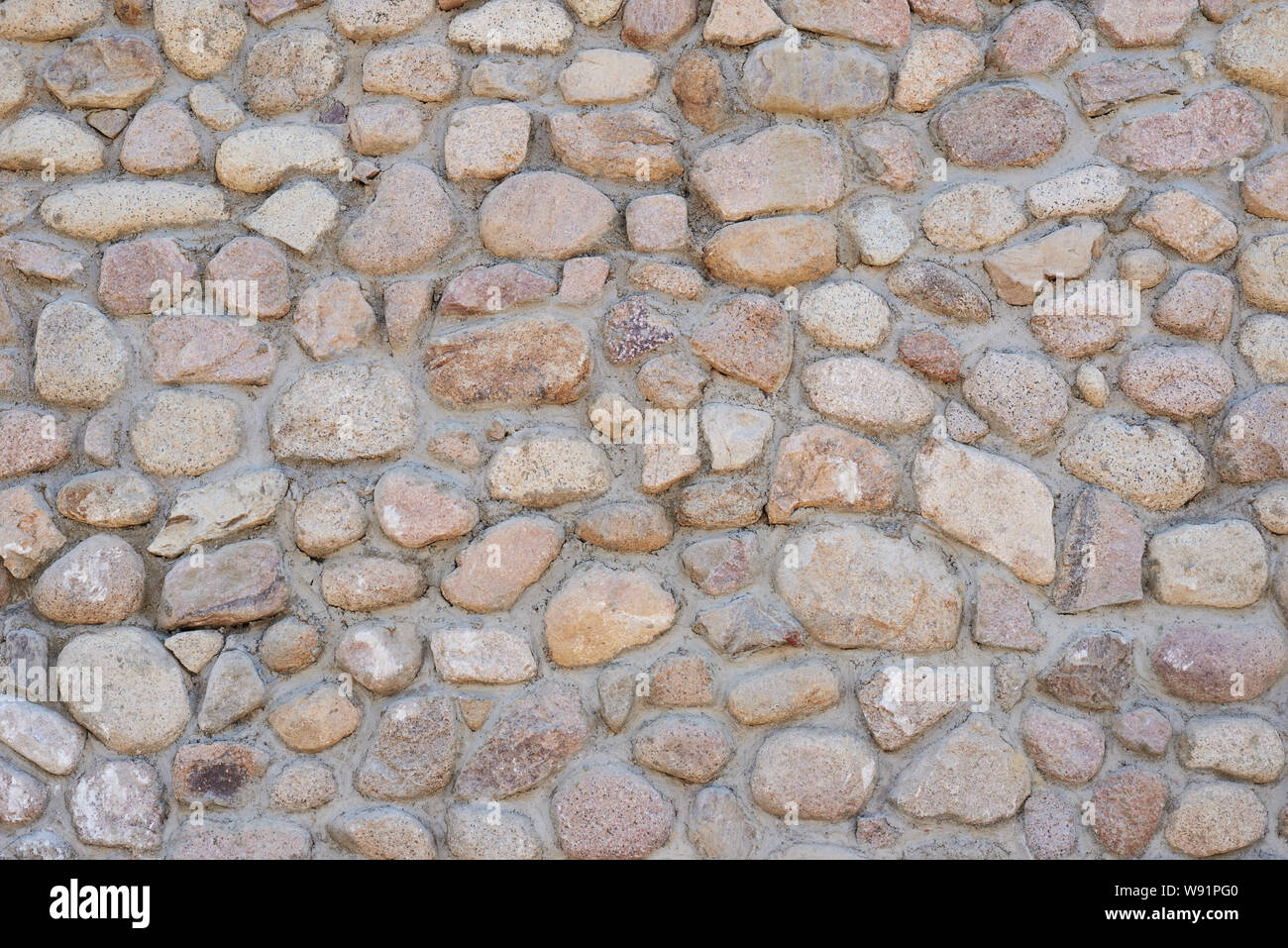 Masonry wall of stones, pattern texture background Stock Photo - Alamy
