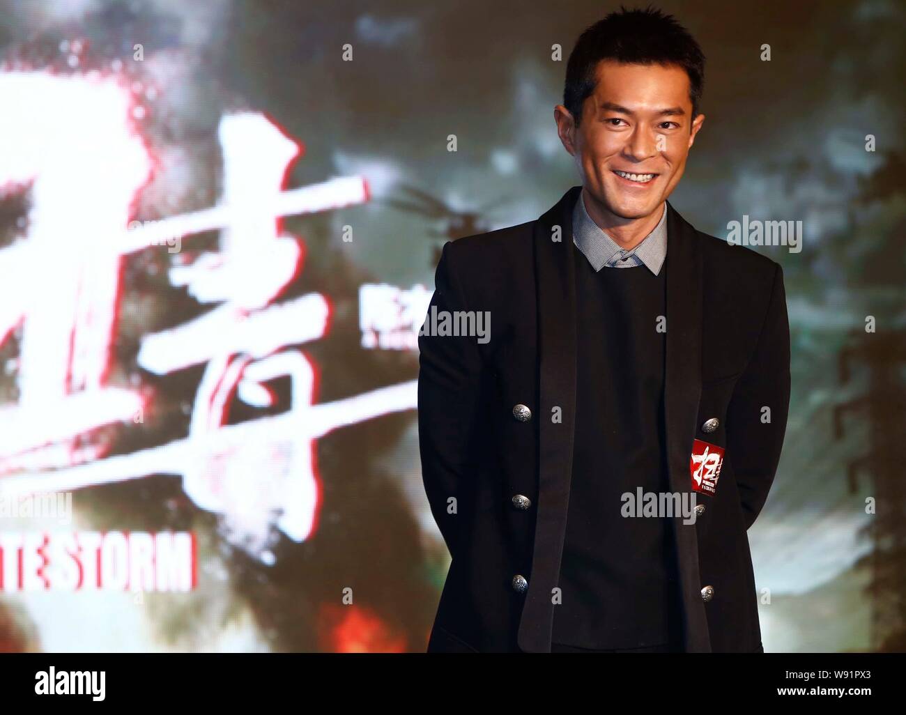 Hong Kong actor Louis Koo smiles during the premiere of his movie, The ...