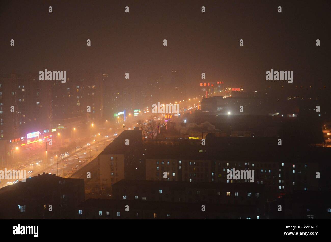 A hazy night view is taken in smog at the Shigehisa Temple in Beijing ...