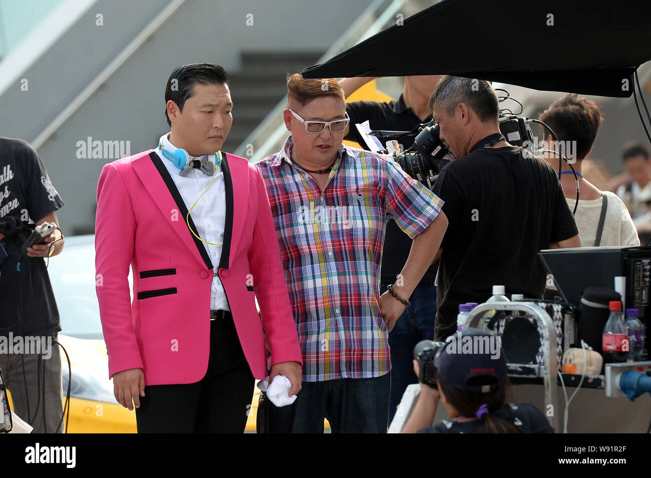South Korean rapper Psy, left, talks with Hong Kong director Chin Kwok ...