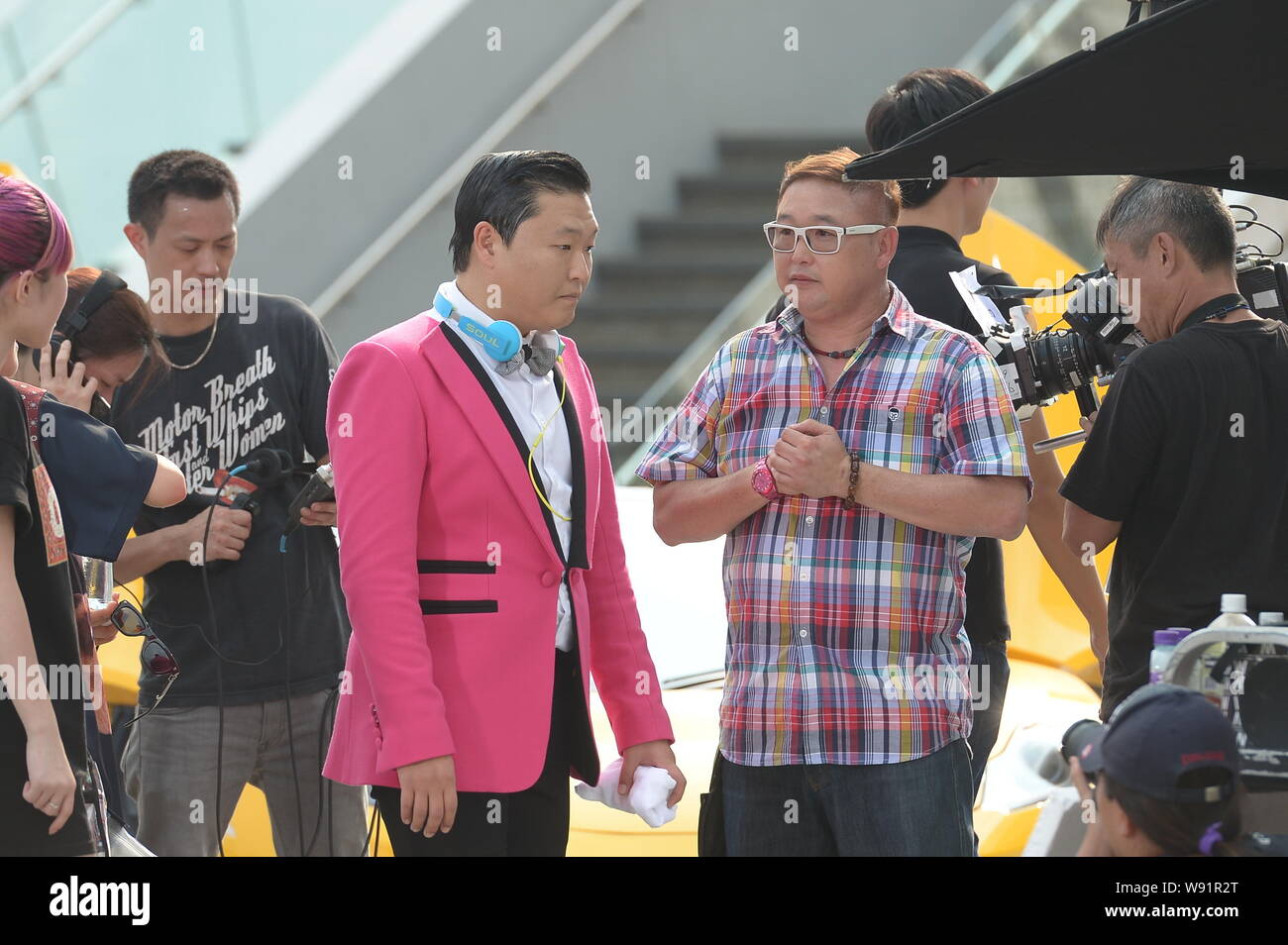 South Korean rapper Psy, left, talks with Hong Kong director Chin Kwok ...