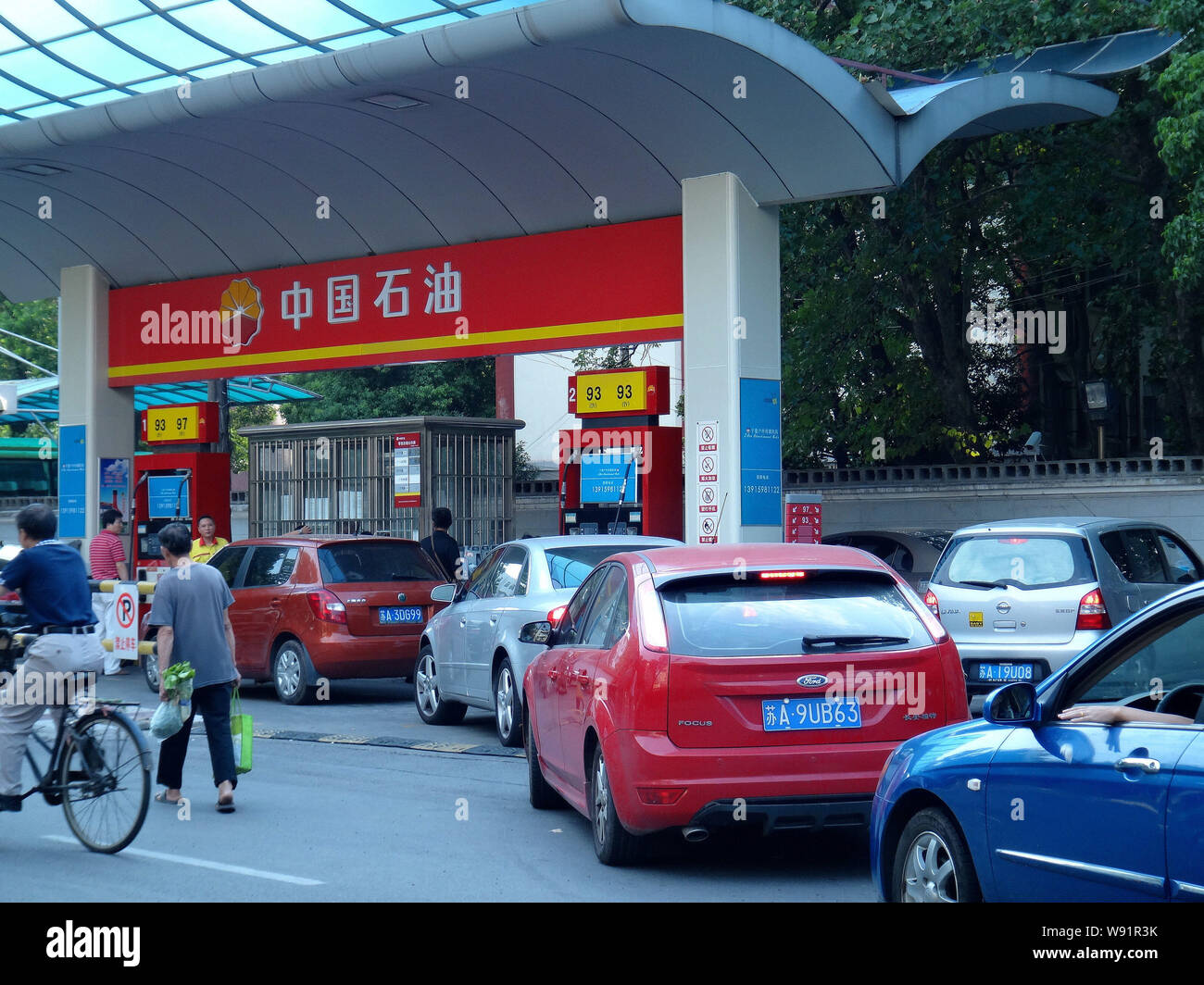 Cars to be refueled line up at a gas station of CNPC (China National ...