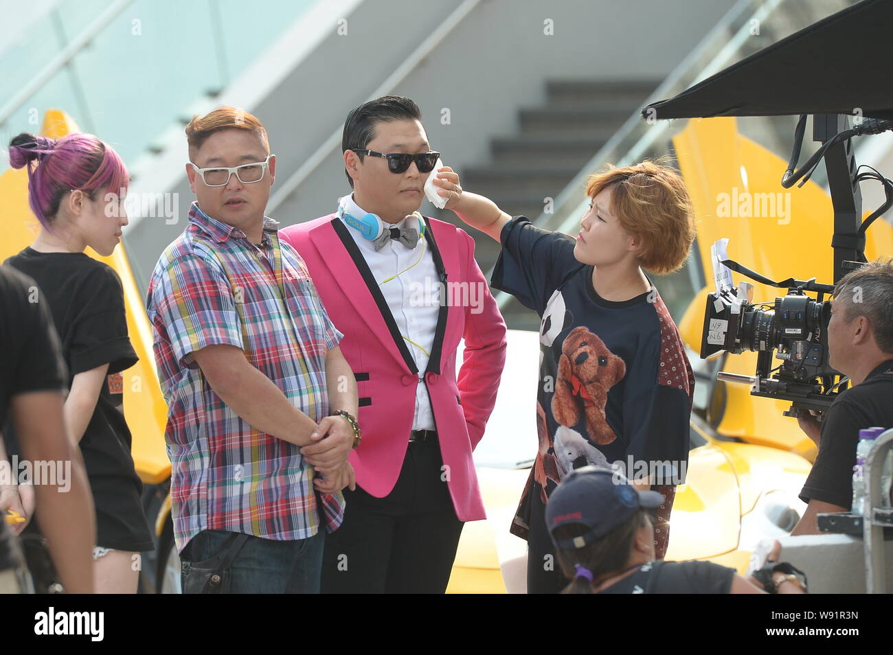 South Korean rapper Psy, right, talks with Hong Kong director Chin Kwok ...