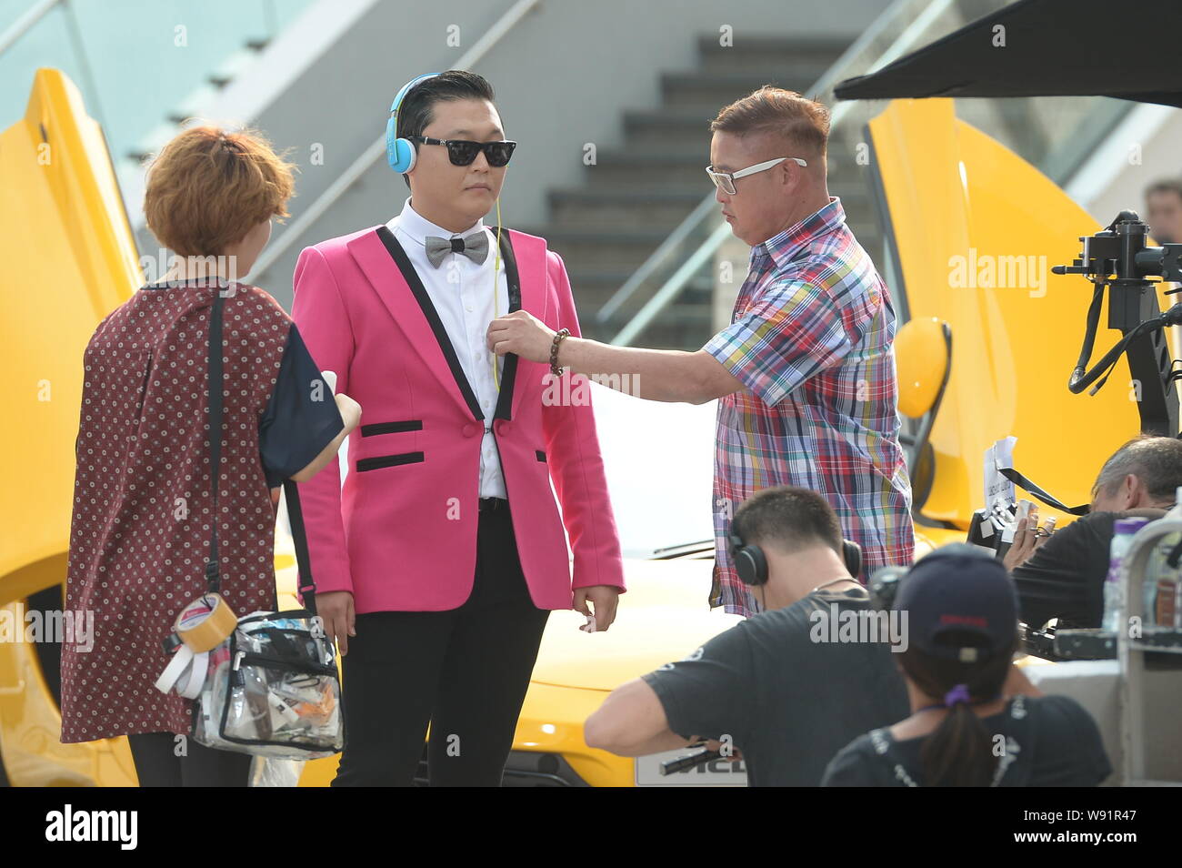 South Korean rapper Psy, left, talks with Hong Kong director Chin Kwok ...