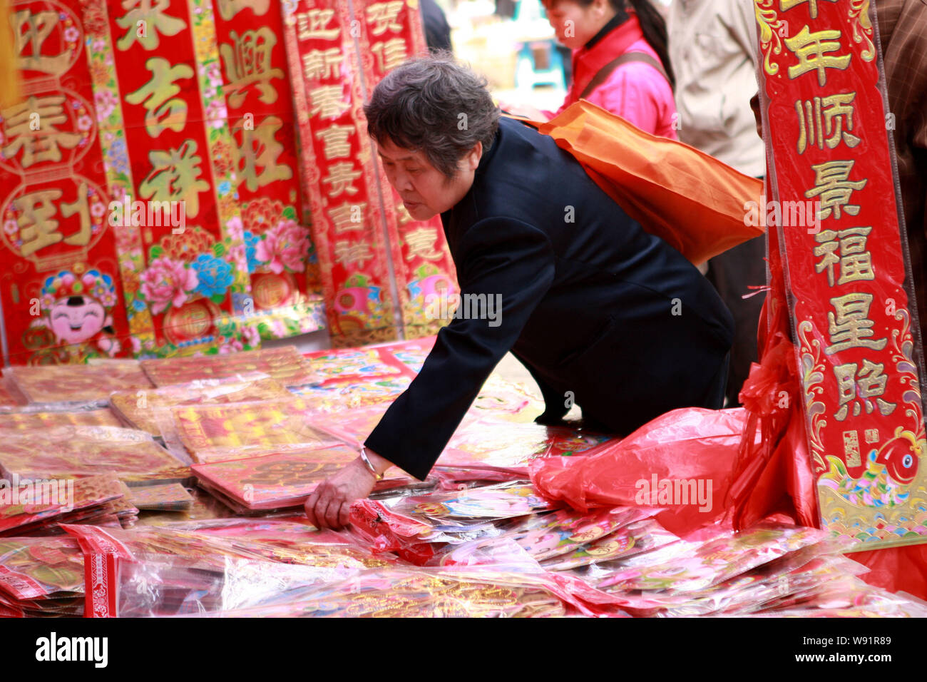 Chinese shoppers buy red decals and lucky scrolls for the upcoming ...