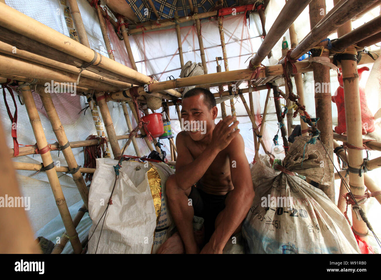 Chinas real-life human snail, Liu Yongchao is seen at his portable home ...