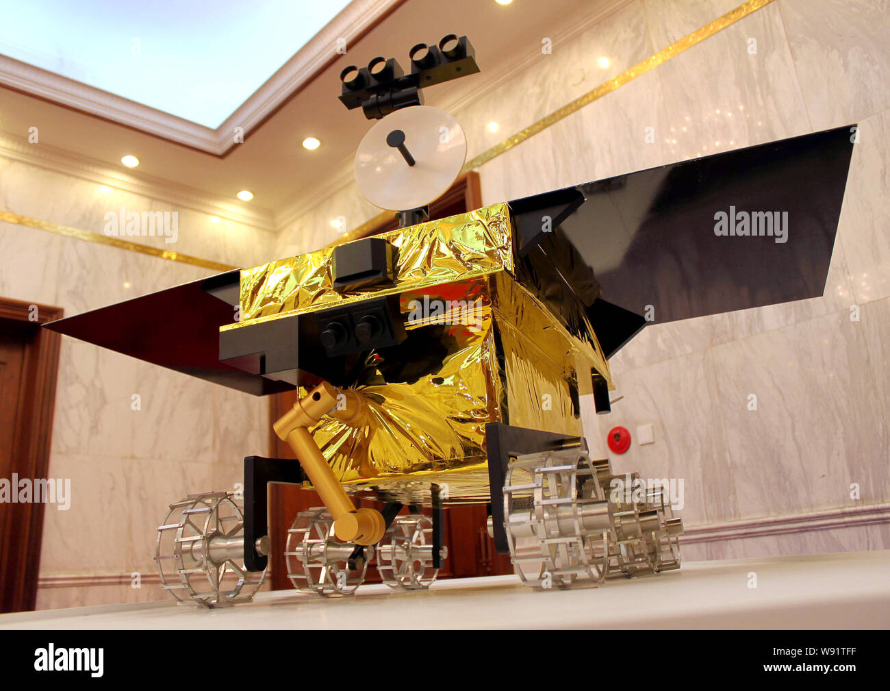 A model of Chinas first moon rover is displayed at a press conference ...