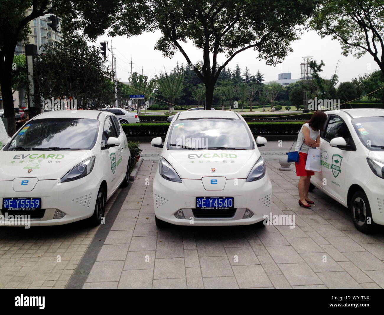 Roewe e50 electric cars of SAIC Motor for rental are parked in front of ...
