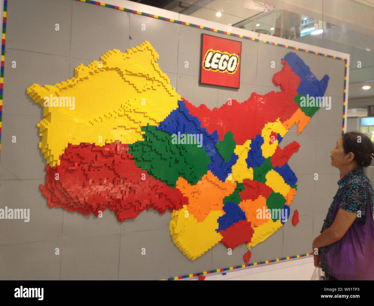 --FILE--A visitor looks at a map of China made by Lego bricks at the ...