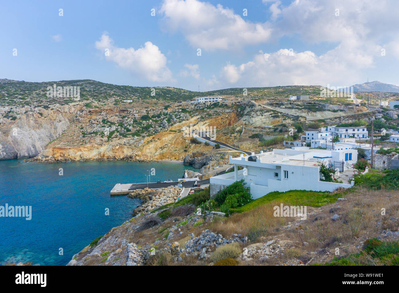 Potamos village with the port and the colorful fishing boats sailing in ...