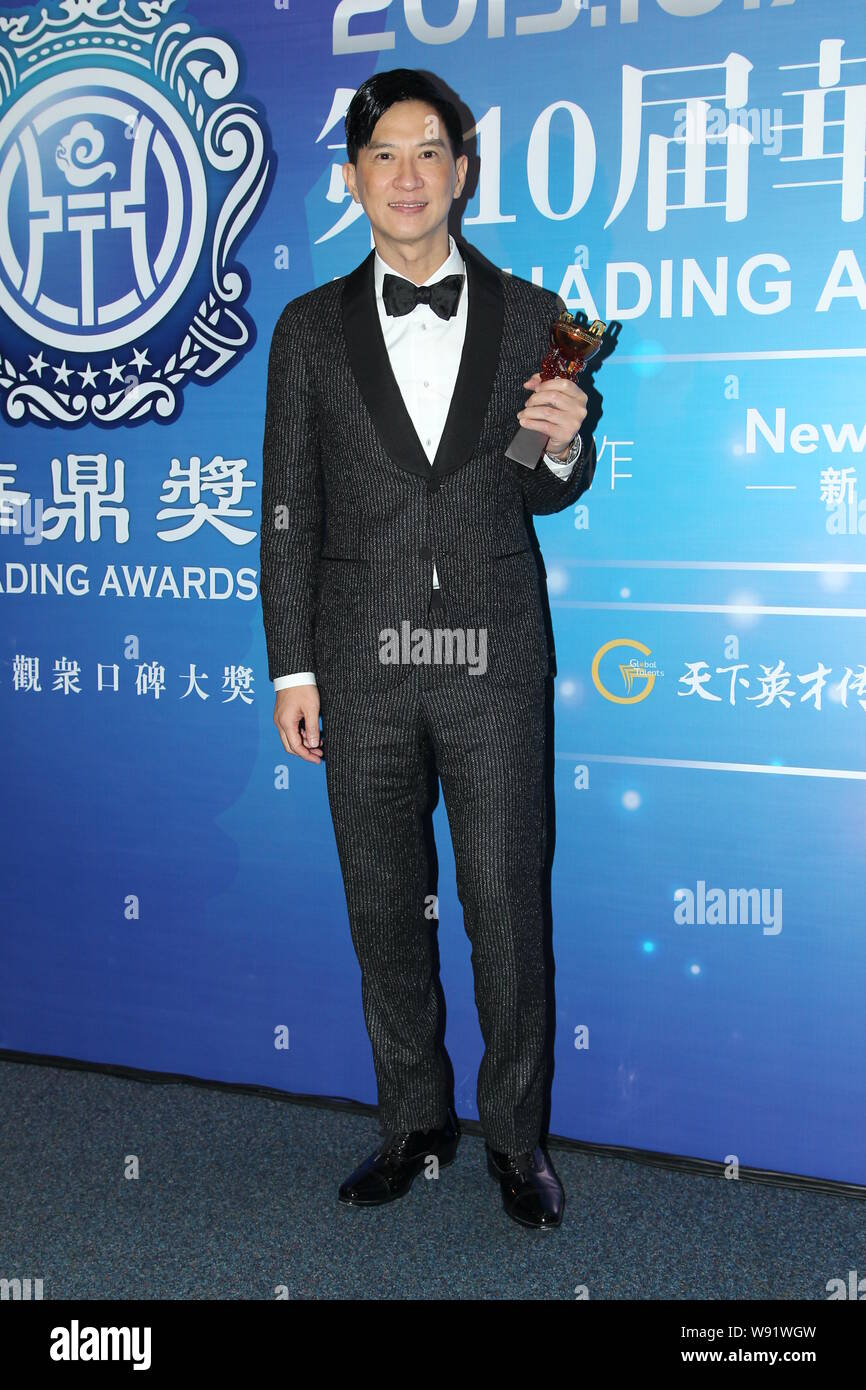 Hong Kong actor Nick Cheung holds his trophy at the back stage of the ...