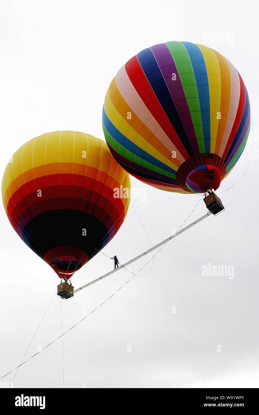Chinese Uighur tightrope walker Aisikaier Wubulikaisimu walks on a ...