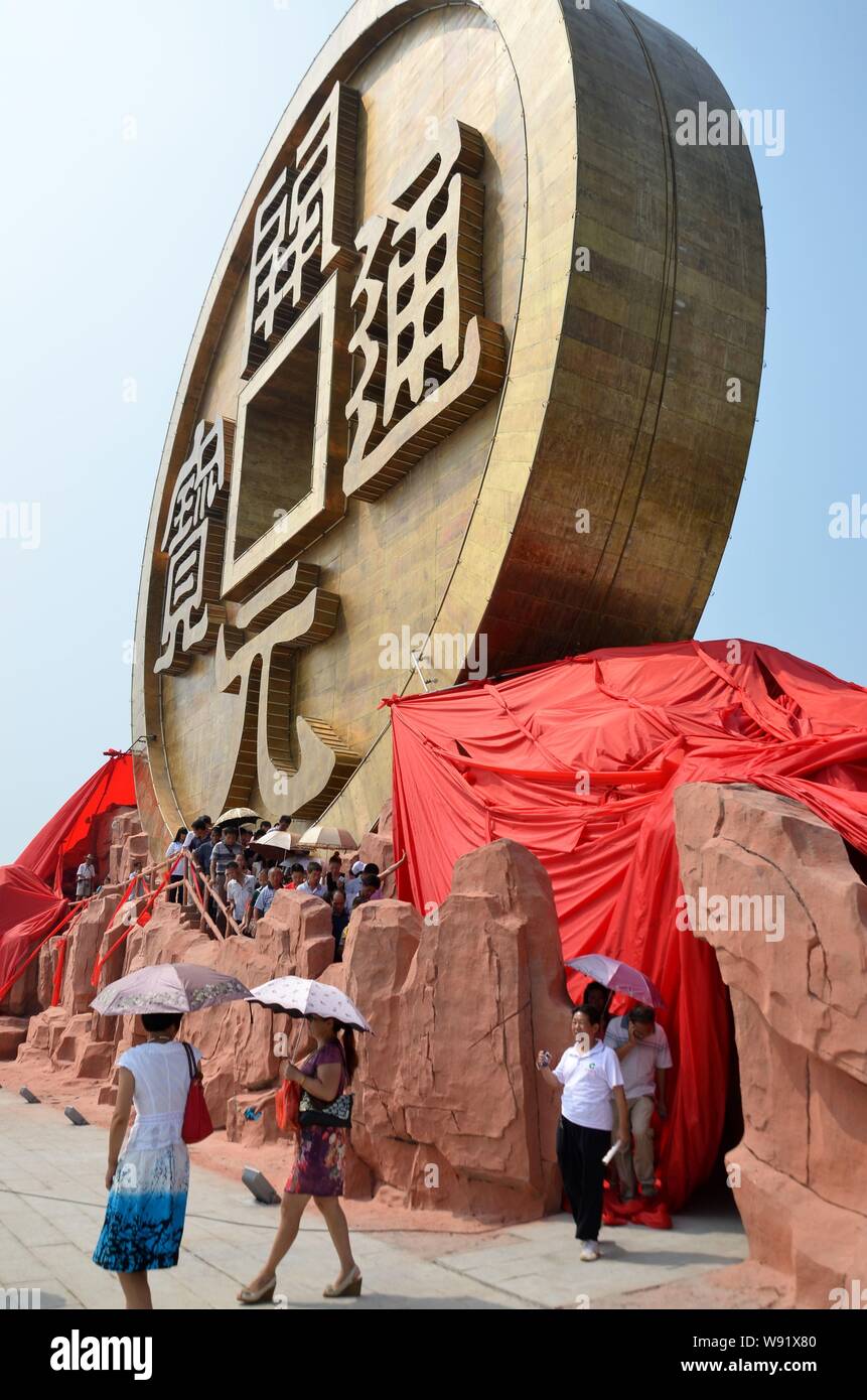 Tourists visit the worlds largest copper coin sculpture at Hunan ...