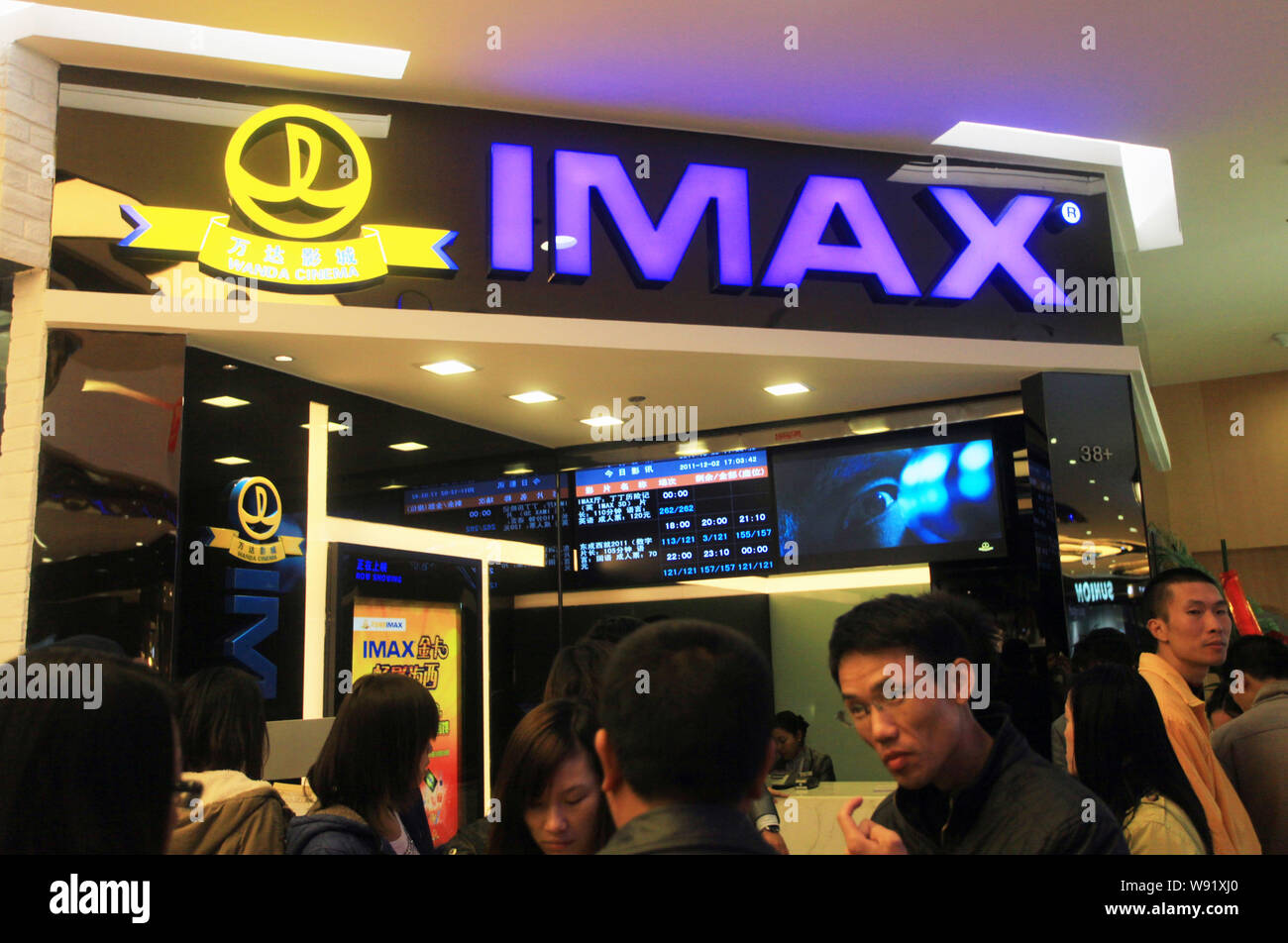 --FILE--Moviegoers buy tickets for IMAX films at a Wanda Cinema IMAX in ...
