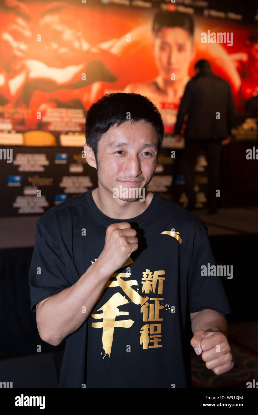 Chinese Olympic boxing champion Zou Shiming poses at a press conference ...