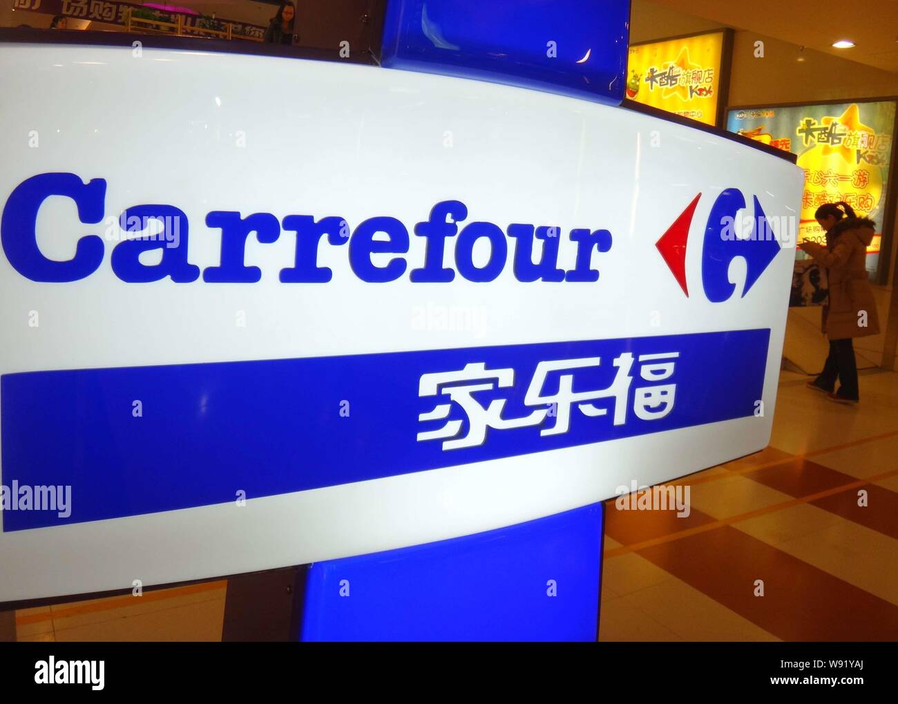 --FILE--A sign board of a French supermarket chain Carrefour is seen in ...