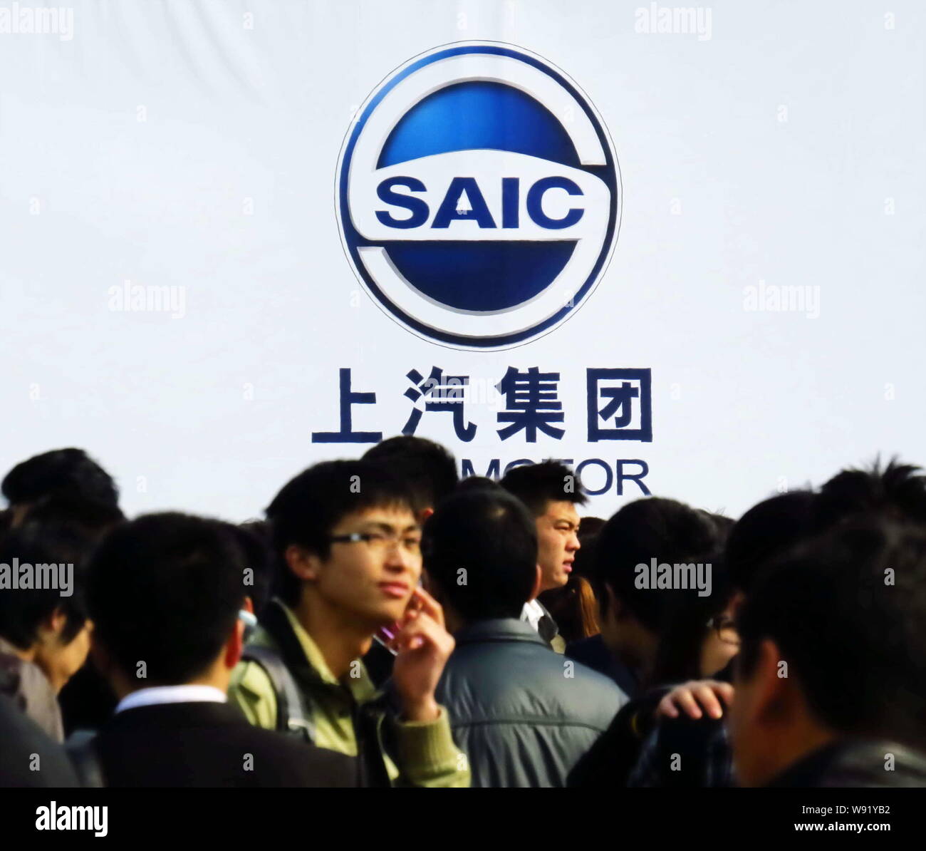 --FILE--People visit the stand of SAIC Motor during the 15th Shanghai International Automobile ...