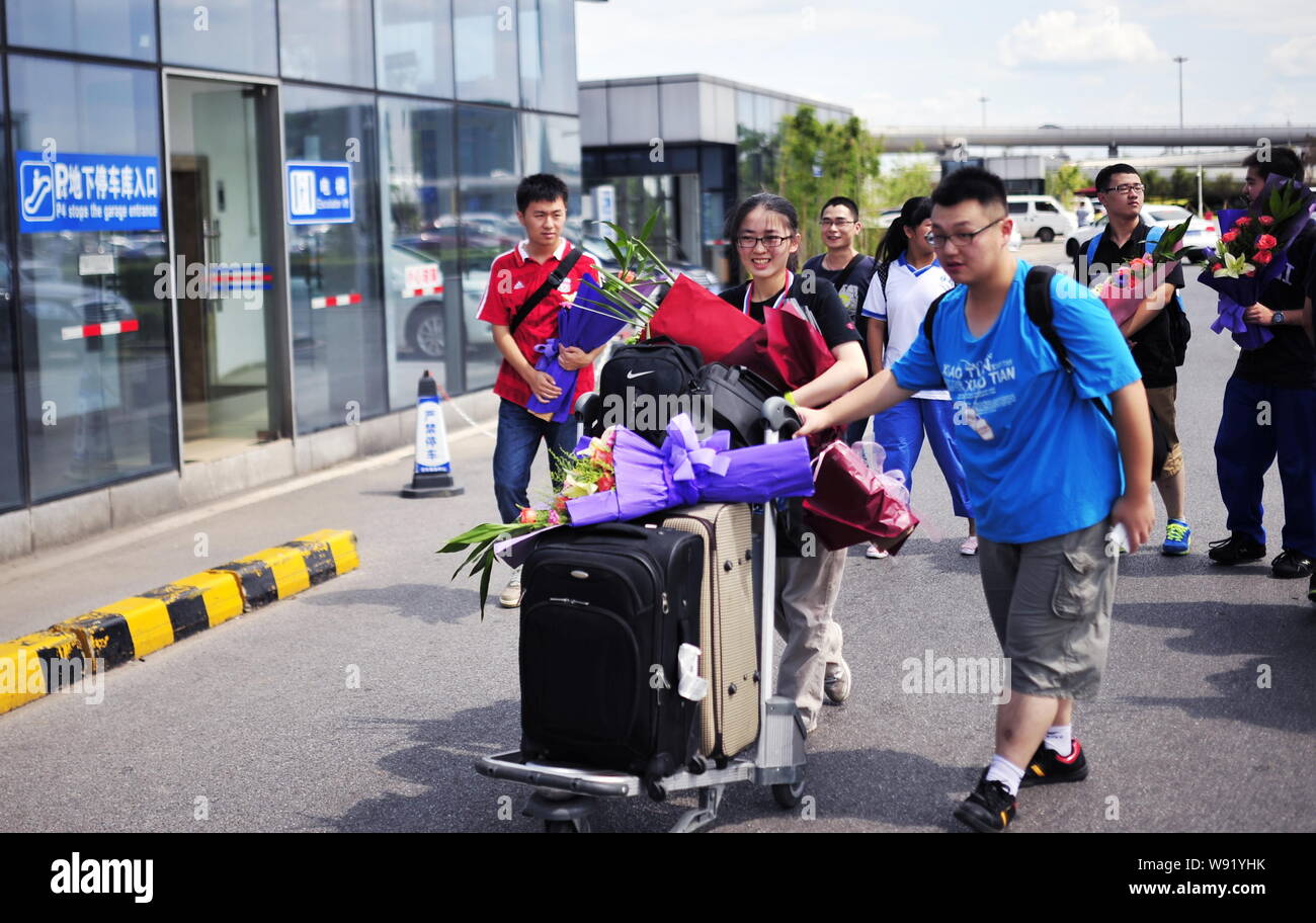 Chinese student Sun Weiwei, second left, one of the gold medal winners ...