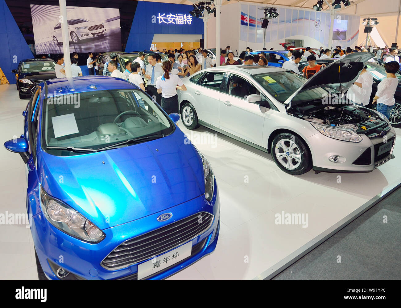 --FILE--Visitors look at Ford cars during an auto show in Hangzhou city ...