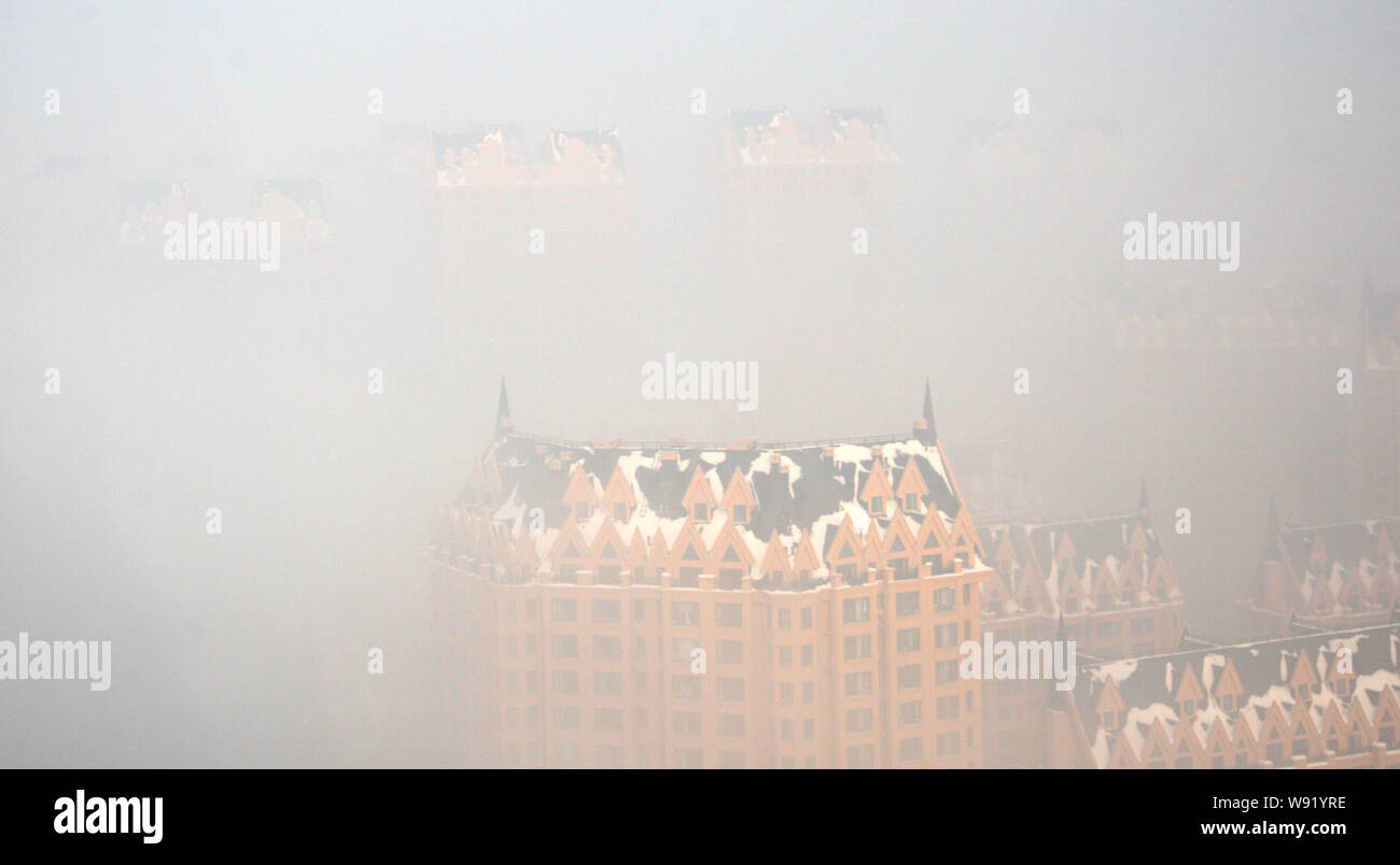 View of high-rise buildings in heavy smog in Harbin city, northeast ...