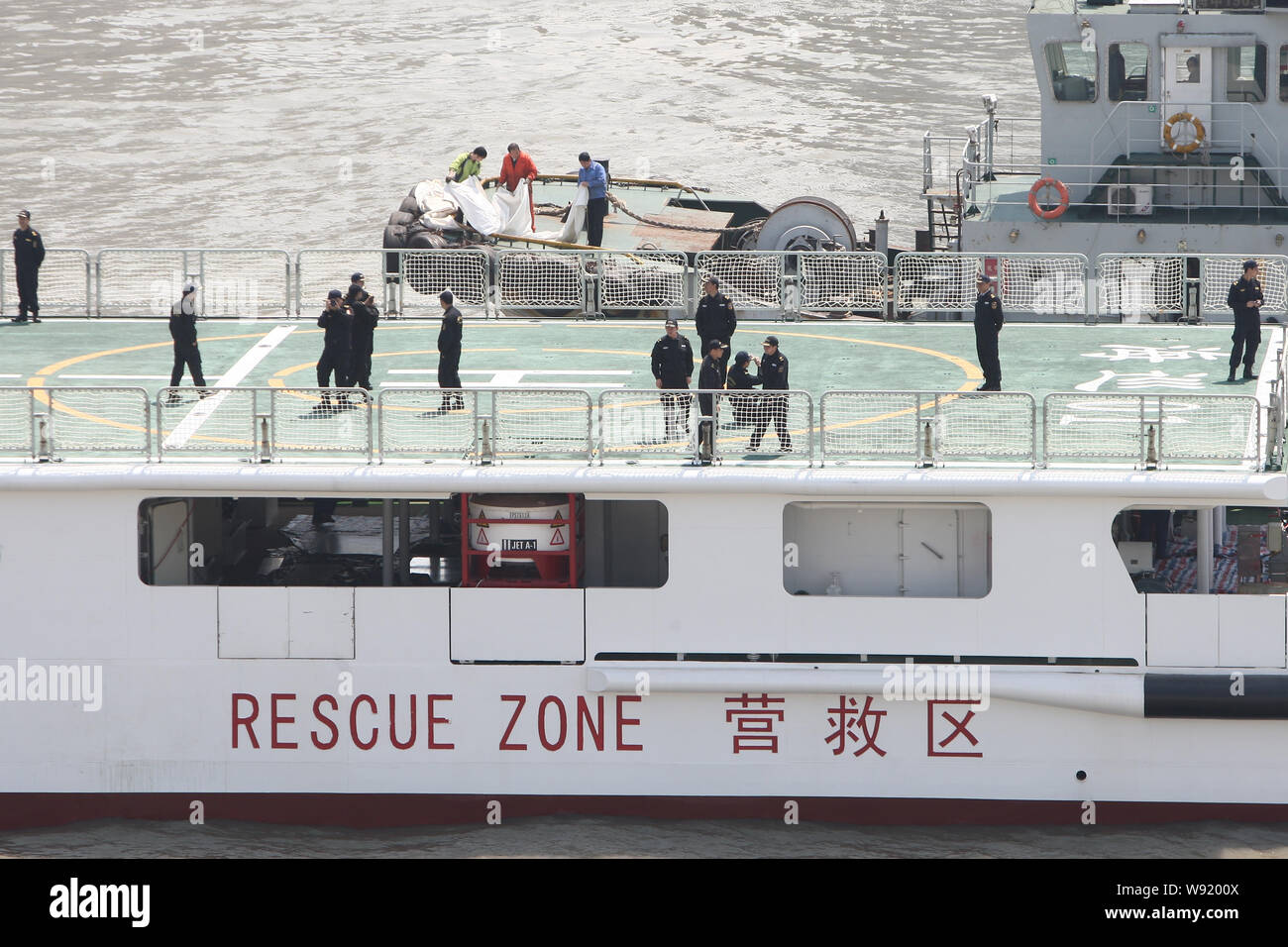 Chinese crew members are seen on the board of Haixun01, Chinas largest ...