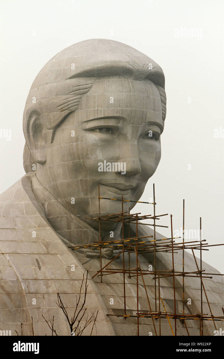 --FILE--Chinese workers are building a stone statue of Soong Ching-ling ...