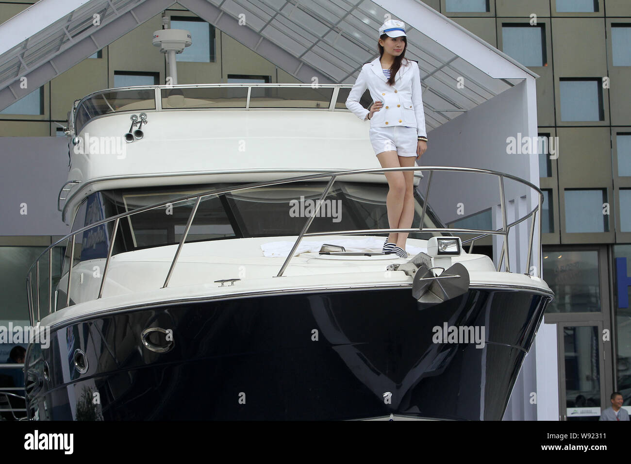 A model poses on a yacht during the 18th China (Shanghai) International ...