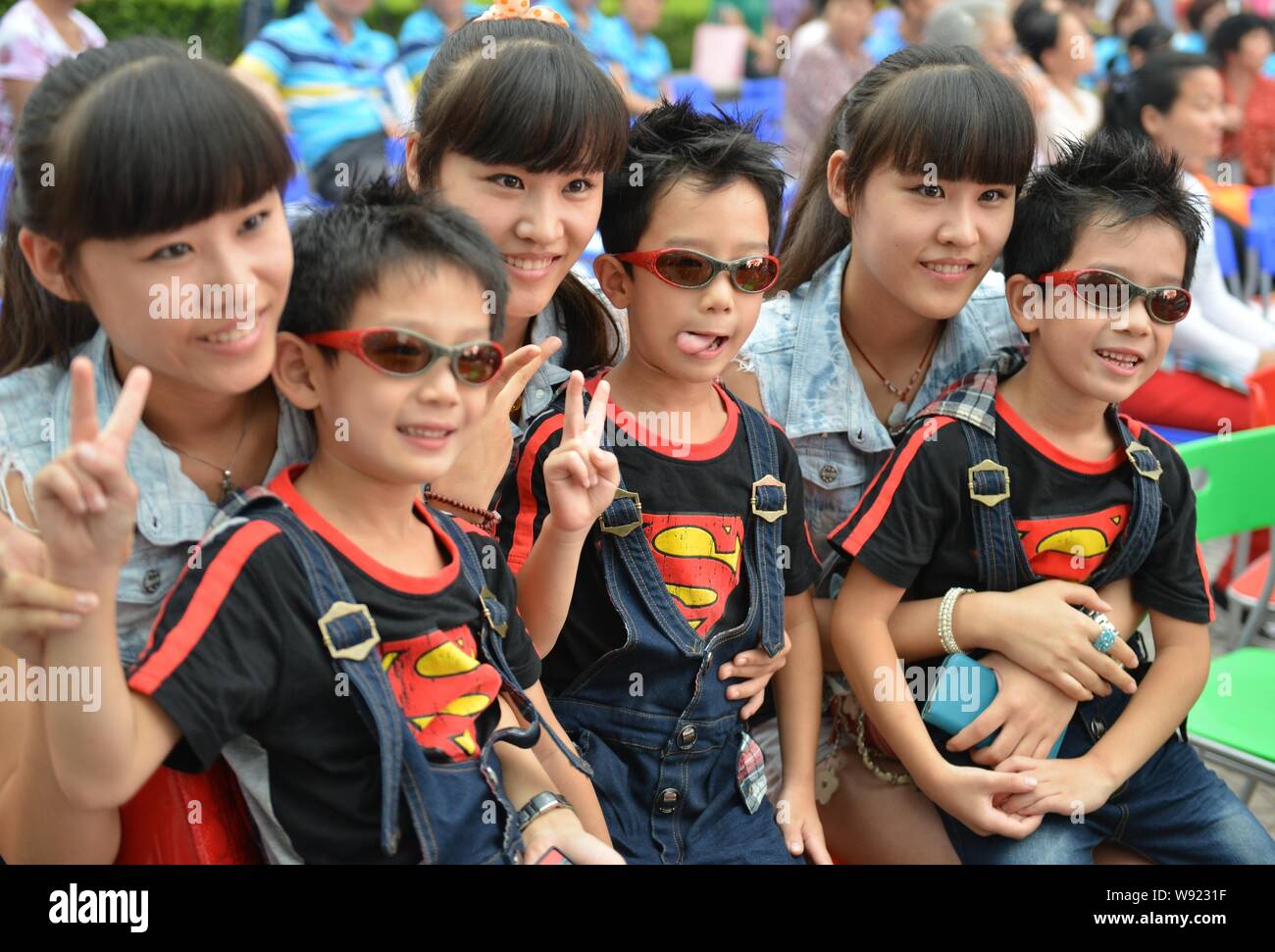 Young Chinese triplets pose at the launch ceremony of the 10th Beijing ...