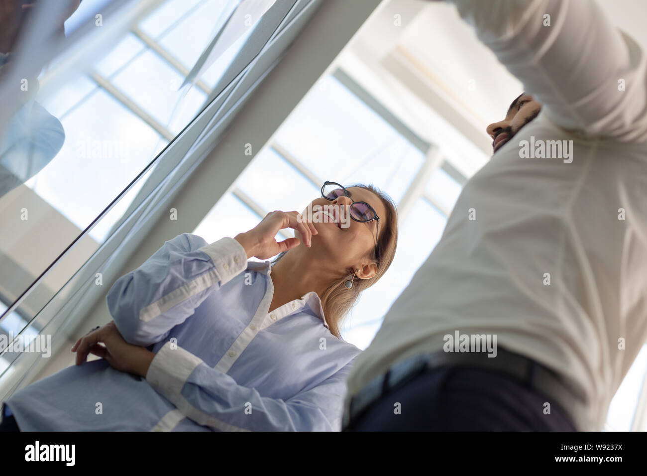 Low angle photo of partners that discussing business idea Stock Photo ...