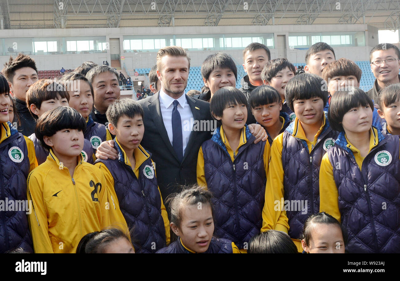 English soccer superstar David Beckham, center, poses with young ...