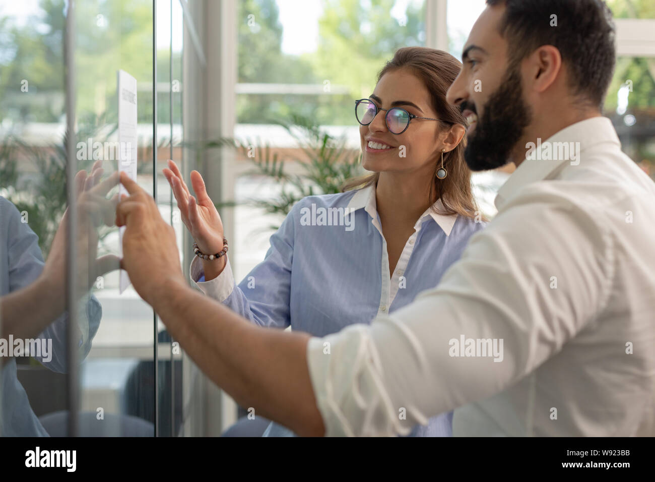 Handsome young man listening to his partner Stock Photo - Alamy